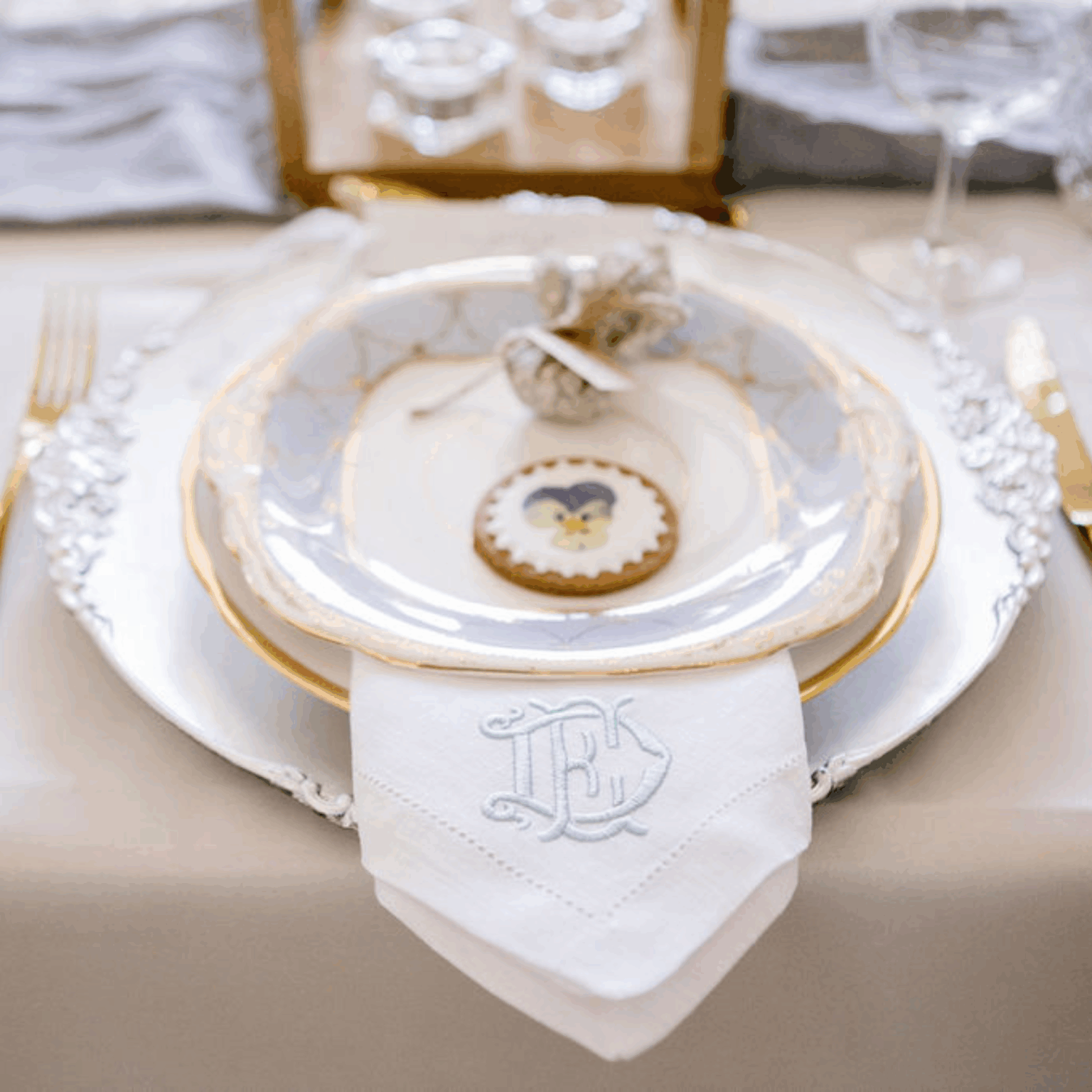 Elevating tables with napkins & bows | The Embroidered Napkin Co